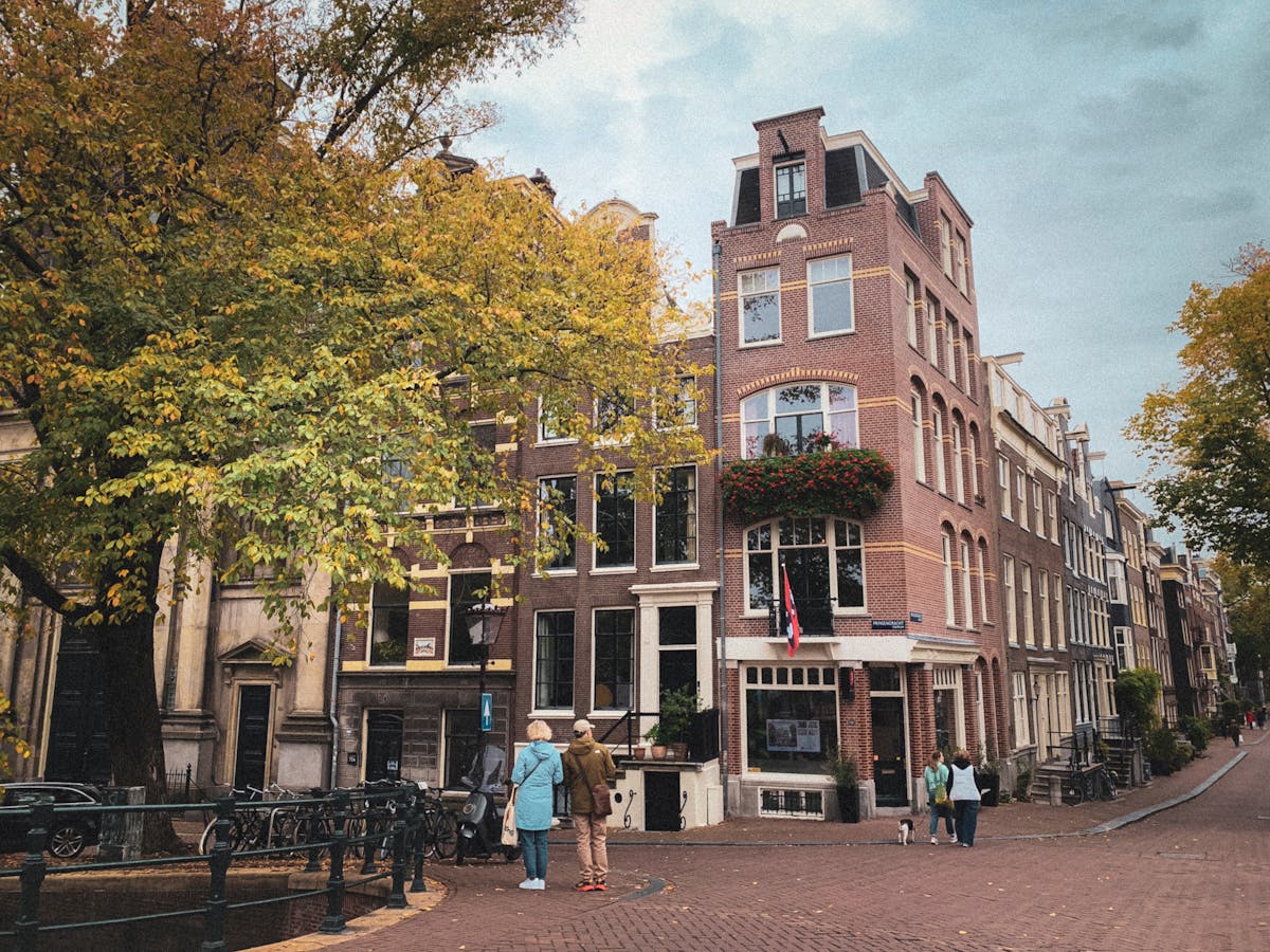 Amsterdam canal houses with autumn foliage