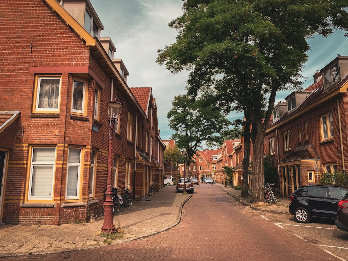 Amsterdam street with classic Dutch architecture and trees