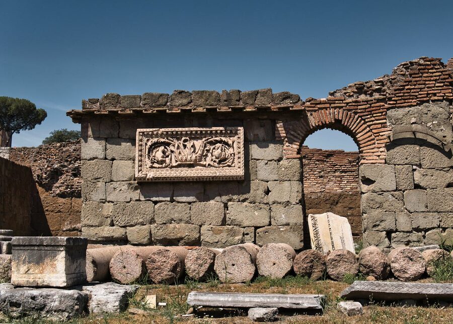 Historic ruins of ancient Rome with stone arches and carvings