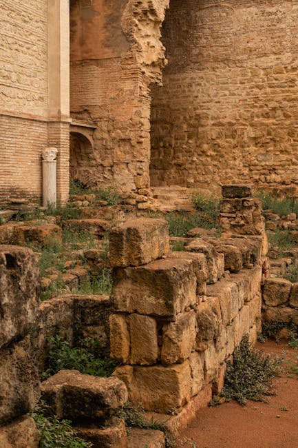 Ancient stone foundations and walls at Medina Azahara with weathered masonry