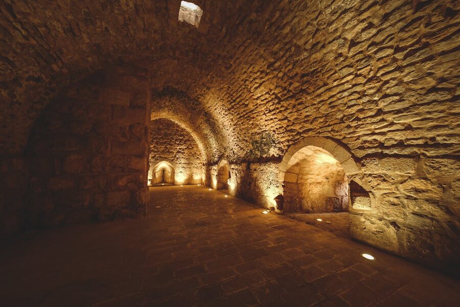 Mysterious ancient stone tunnel with soft ambient lighting