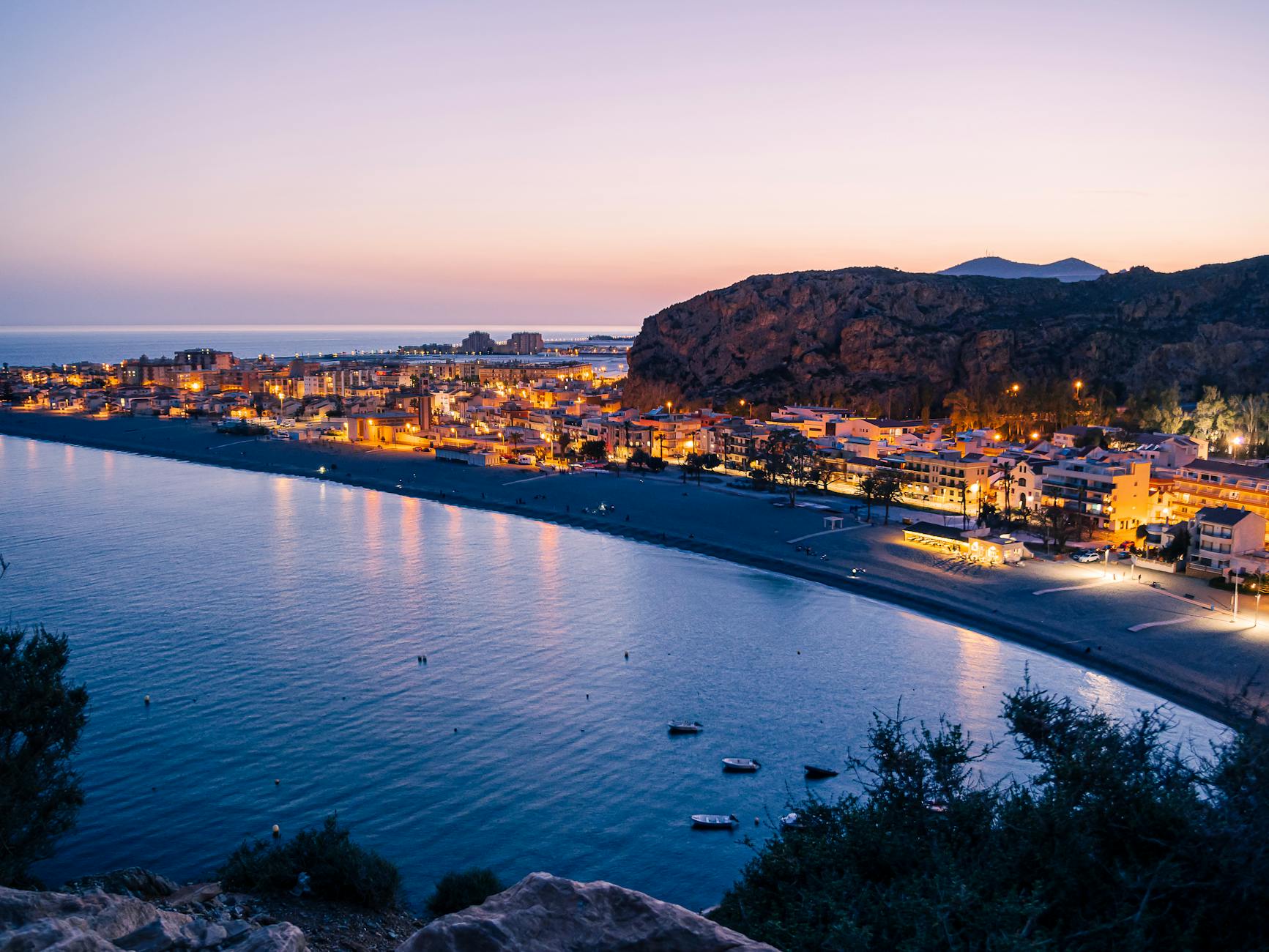 Twilight view of illuminated coastline in Andalusia Spain