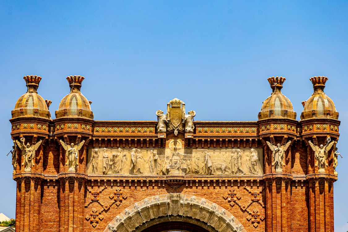 Majestic Arc de Triomf monument in Barcelona under clear blue sky