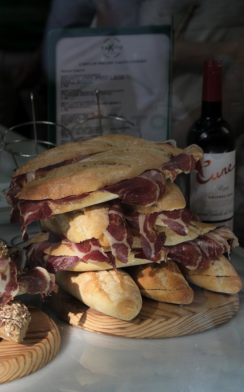 Fresh baguettes with Spanish ham on display at a Seville cafe