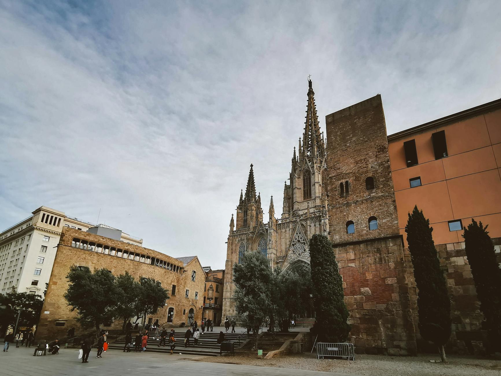 Gothic cathedral facade in Barcelona surrounded by urban architecture