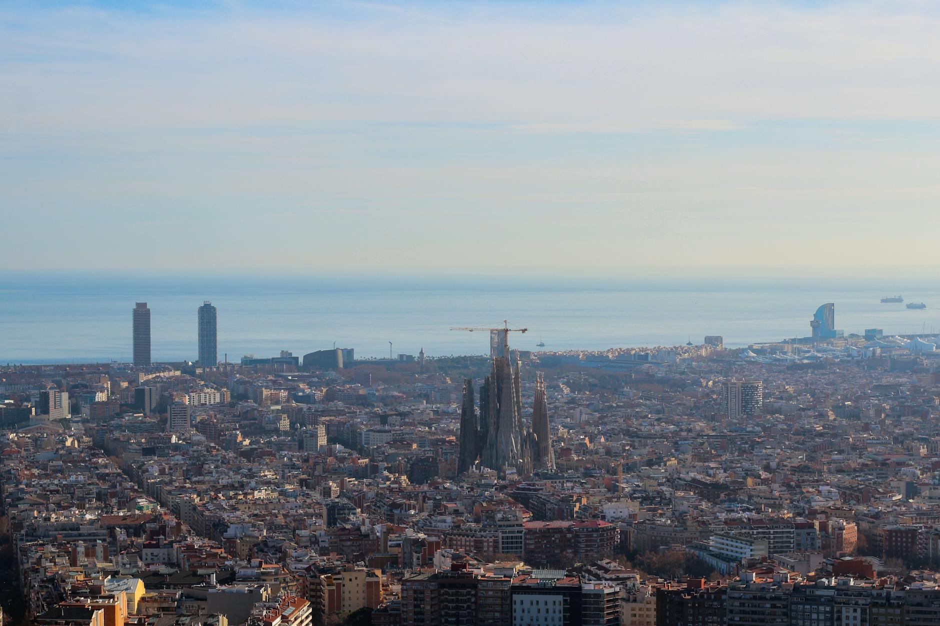 Barcelona city skyline lit up during evening twilight