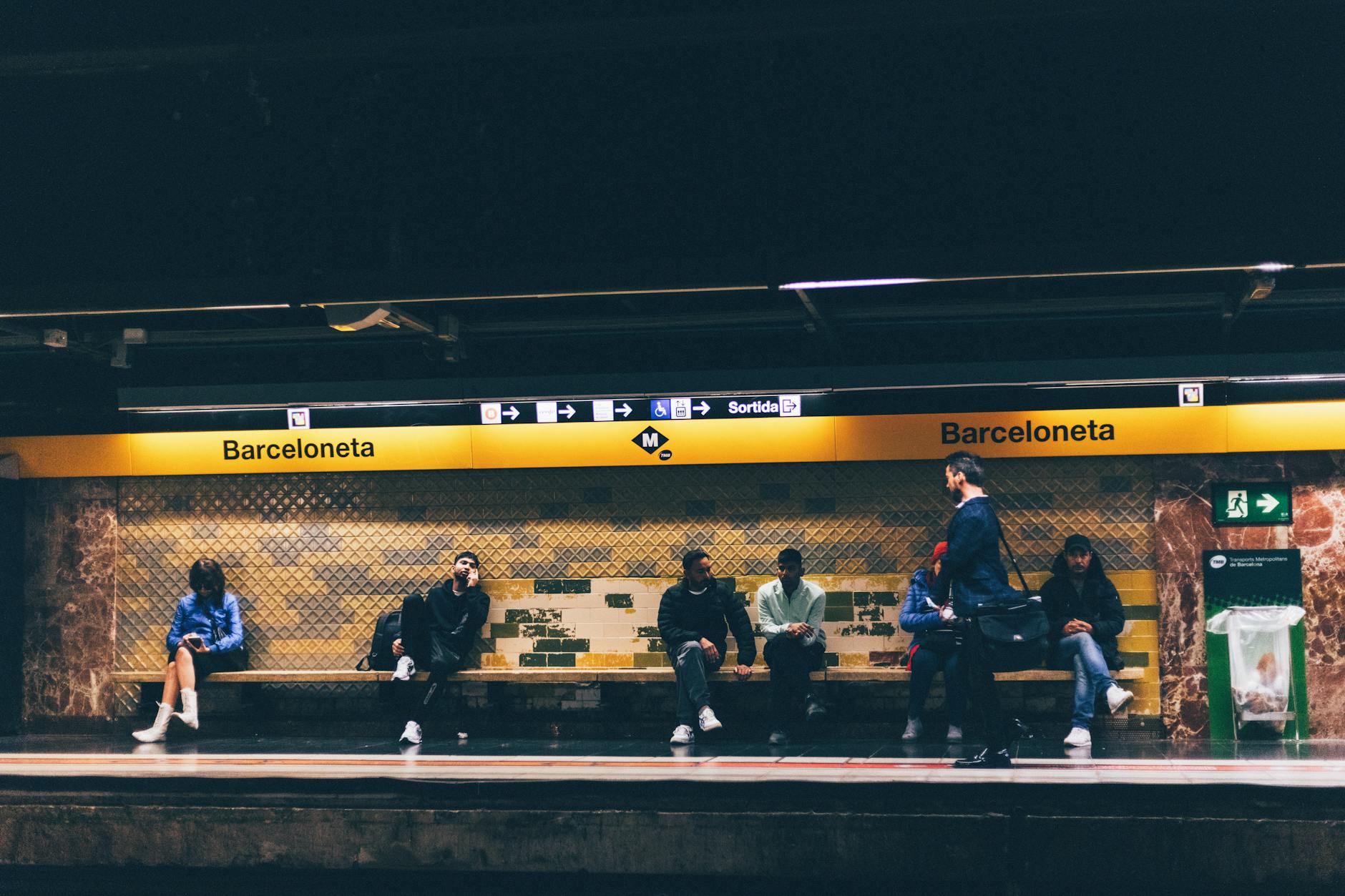 Commuters at a Barcelona metro station platform