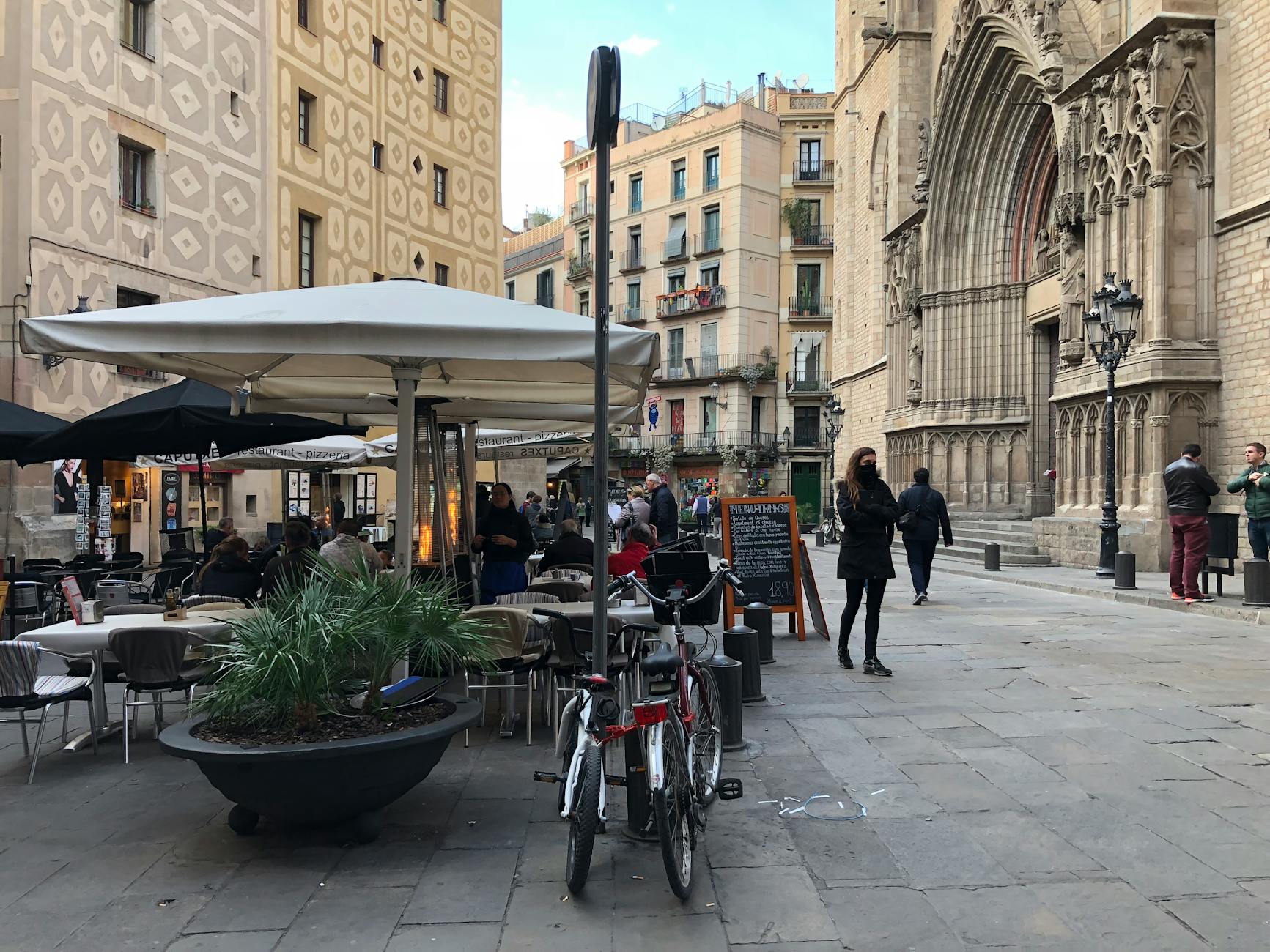 Lively street scene by Santa Maria del Mar church in Barcelona El Born neighbourhood