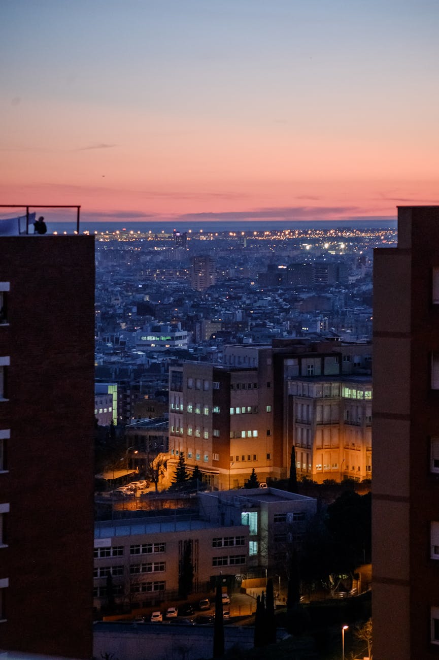 Barcelona illuminated skyline at sunset with warm golden light