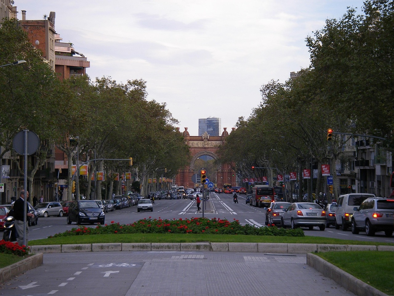 City street view of Las Ramblas in Barcelona with stone archway