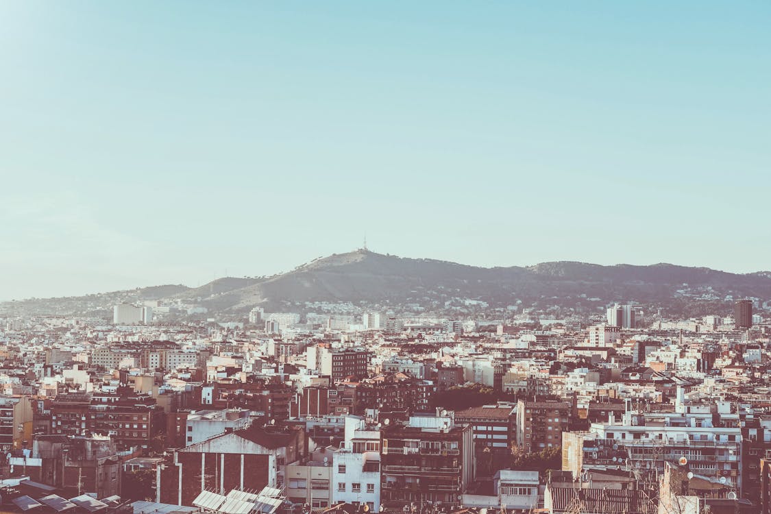 Panoramic daytime view of Barcelona from Montjuic with port and cityscape