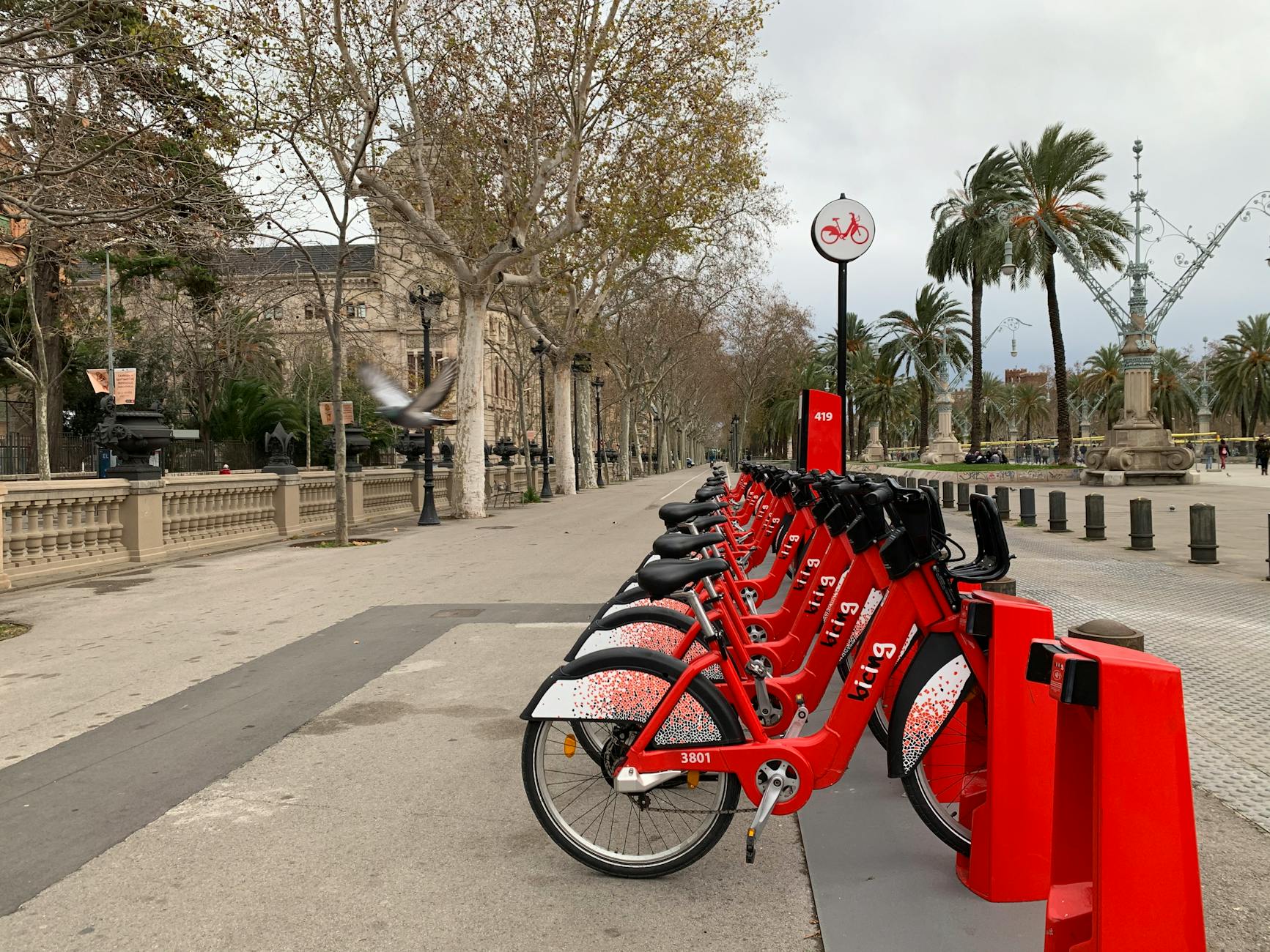 Rental bicycles parked on a scenic Barcelona street