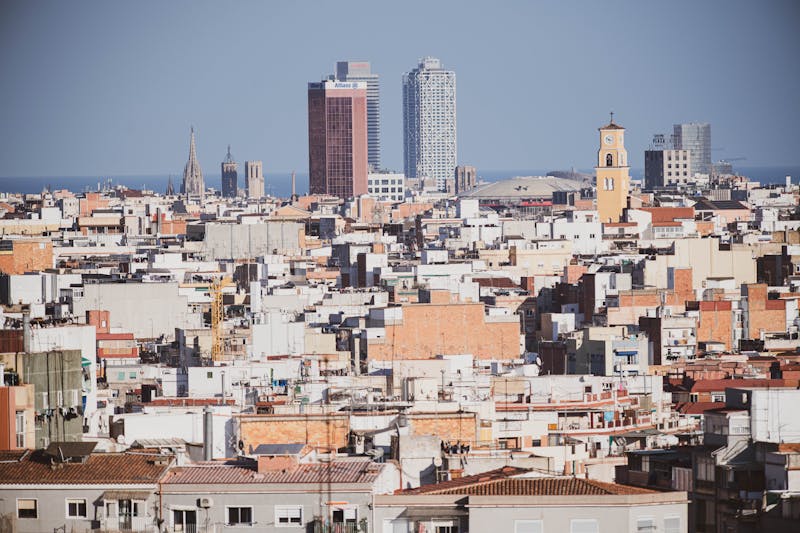 Sunny view of Barcelona urban skyline with iconic landmarks and buildings