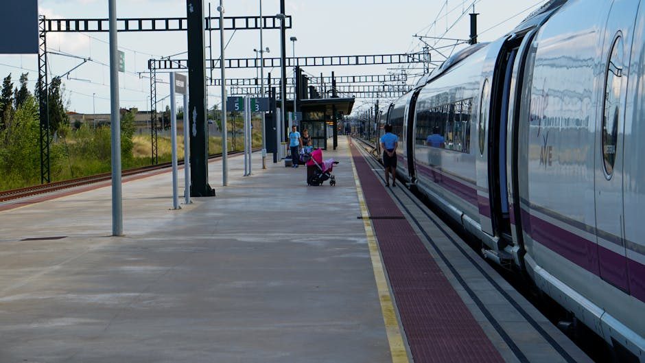 A high-speed AVE train at Barcelona Sants station platform