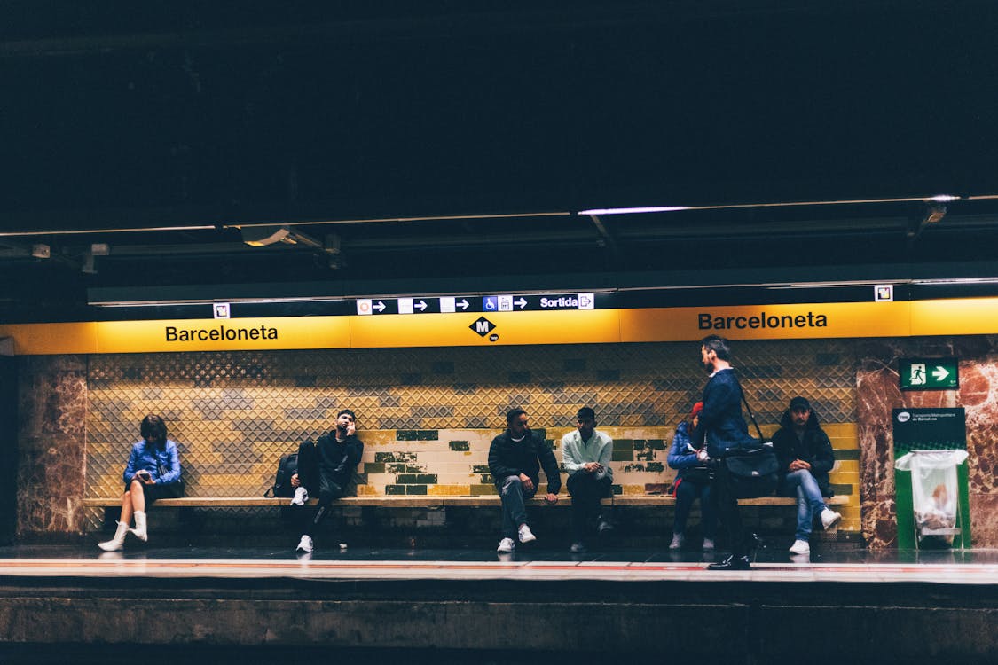 People waiting at Barceloneta metro station platform in Barcelona