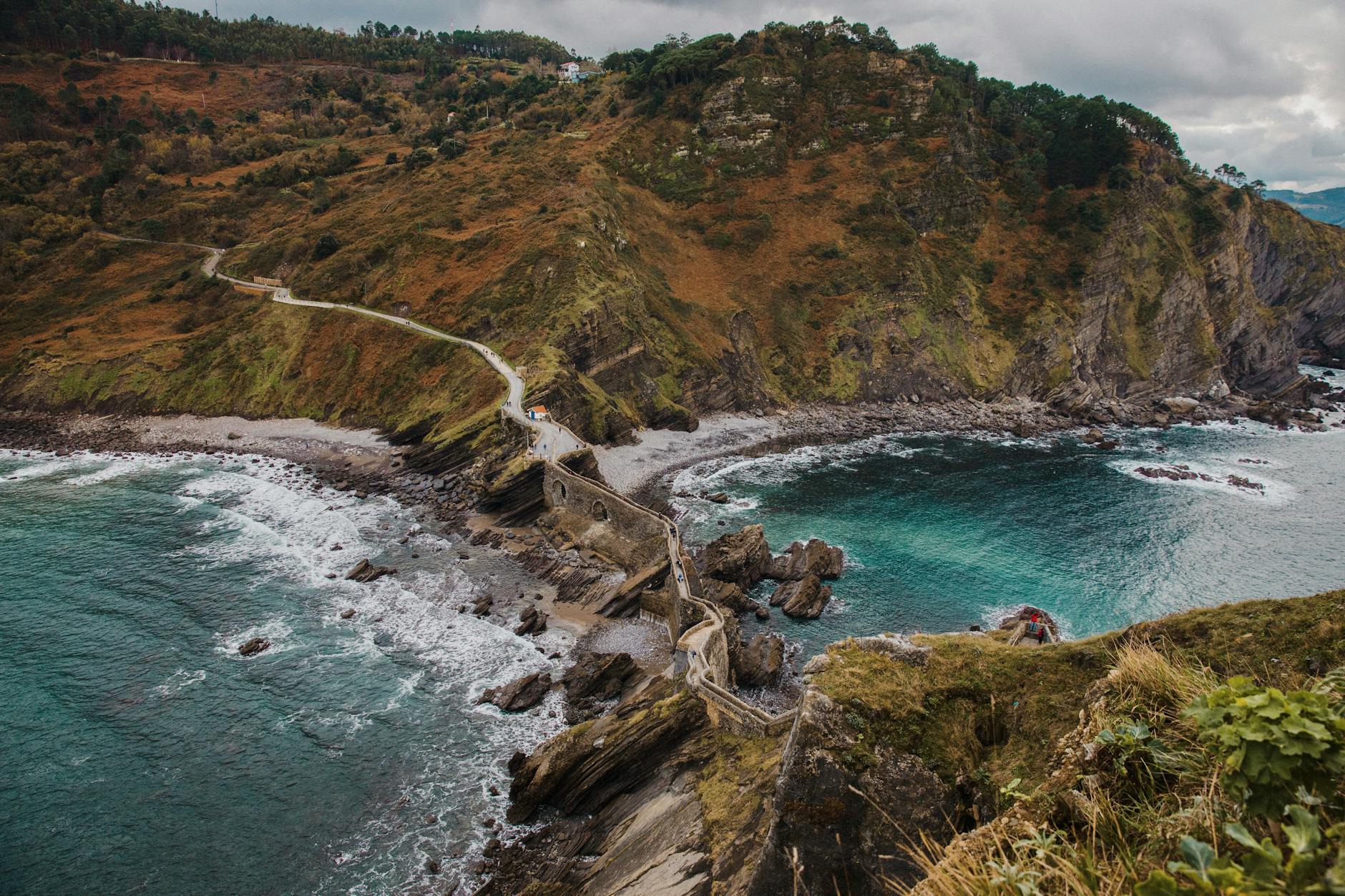 Dramatic green cliffs and crashing waves along the Basque Country coast in northern Spain