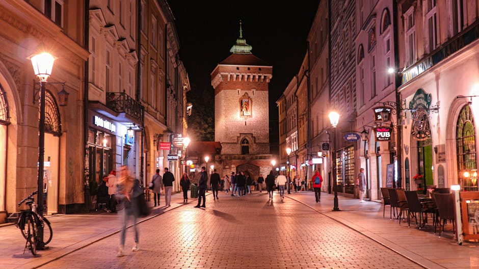 Night street scene in Krakow with St Florian's Gate