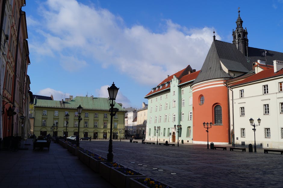Kraków's Small Market Square with colorful townhouses and Renaissance architecture