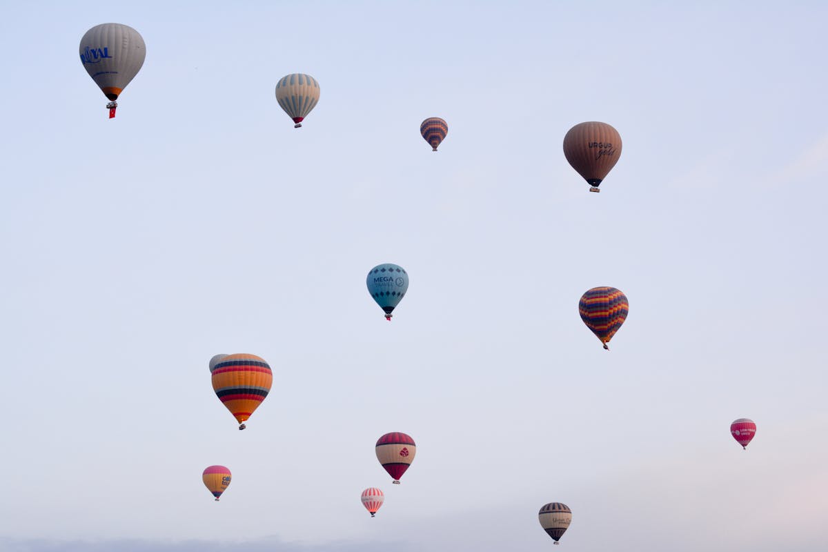 Hot air balloons floating over Cappadocia Turkey during dawn
