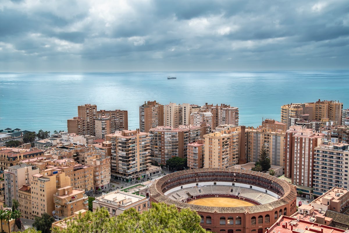 View of the Roman amphitheater and Malaga seaside cityscape