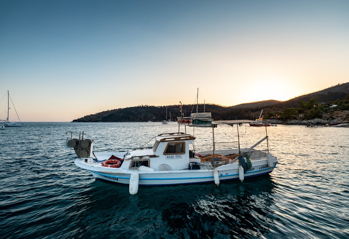 A boat sailing on the calm Mediterranean sea