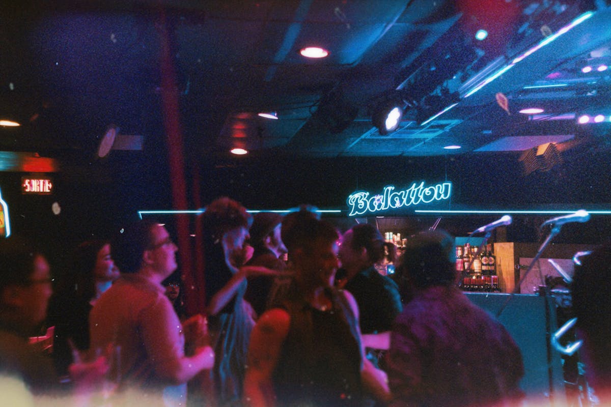 People dancing in a nightclub atmosphere
