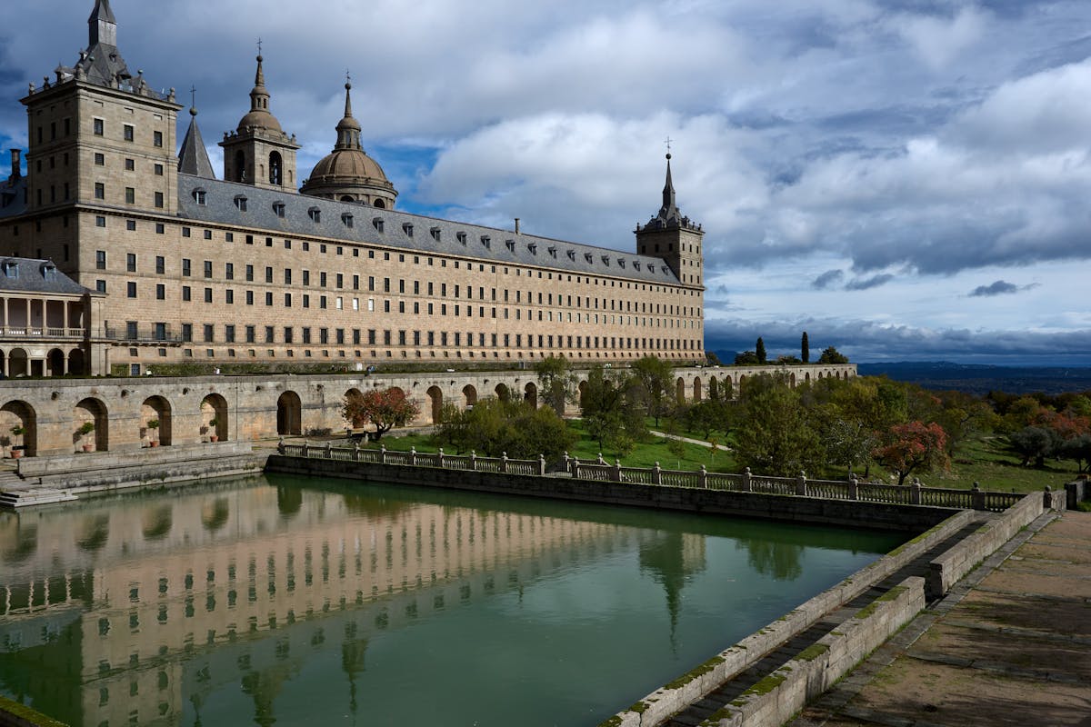 El Escorial monastery reflecting in a tranquil pond