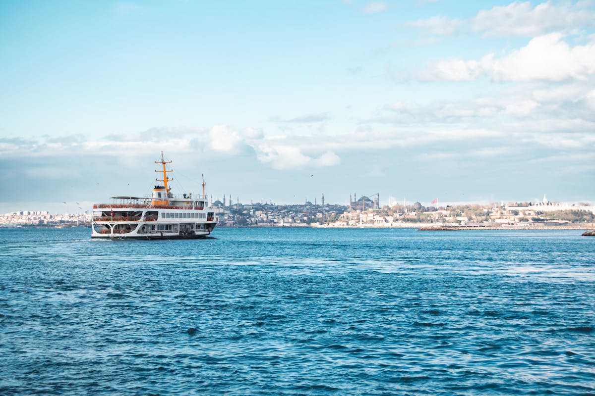 Ferry crossing the Bosphorus with Istanbul skyline and mosques in the background