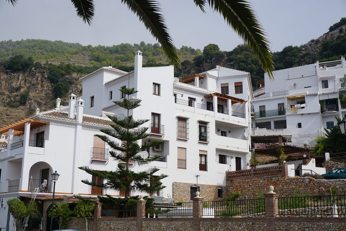 White Spanish townhouses in scenic hillside area