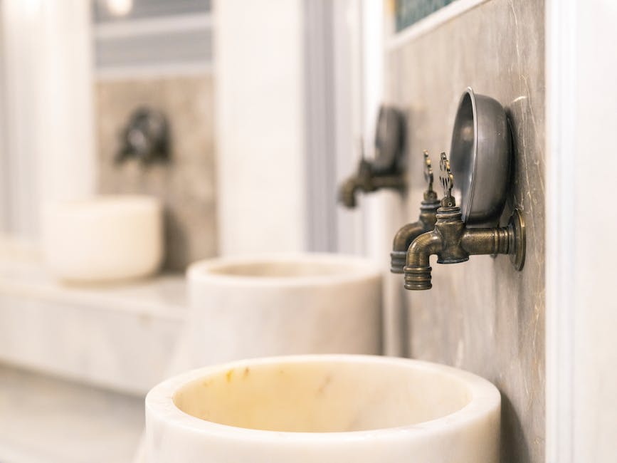 Close-up of vintage Turkish bath faucets with marble basins