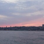 Istanbul skyline during sunset seen from the Bosphorus with warm evening colors