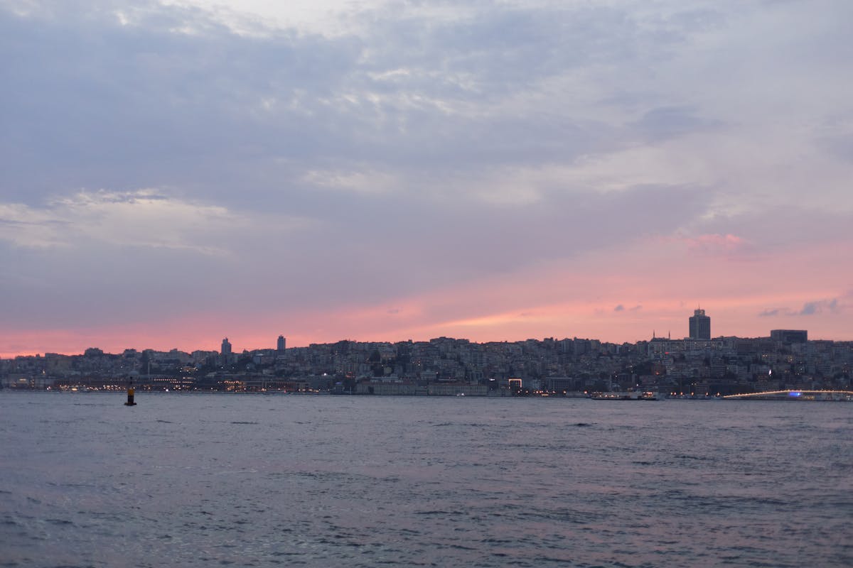 Istanbul skyline during sunset seen from the Bosphorus with warm evening colors