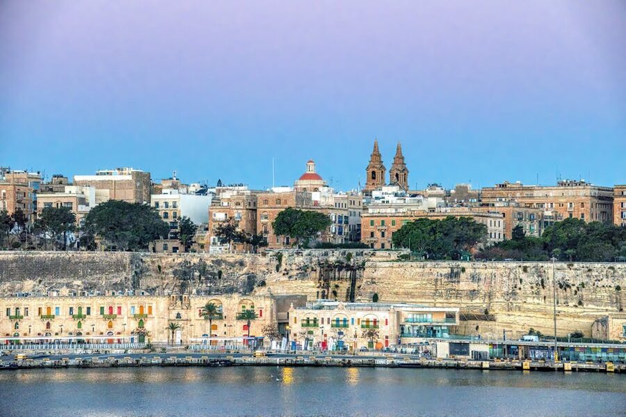Panoramic view of Valletta's historic skyline and waterfront in Malta