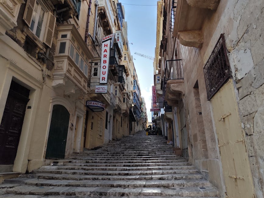 Picturesque street in Valletta with traditional Maltese balconies and stone steps