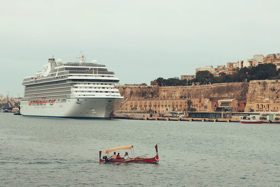 Luxury cruise ship moored in the scenic Valletta harbor with historic buildings