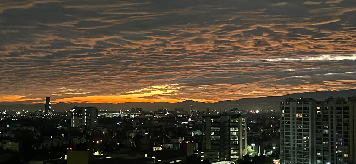 Tourists walking barefoot on white terraces at Pamukkale
