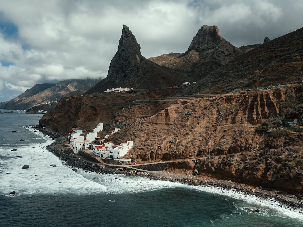 Dramatic volcanic cliffs and ocean waves along Tenerife coastline