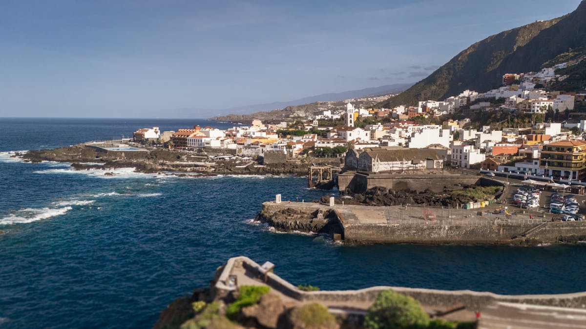 Aerial view of coastal town Garachico along the rugged Tenerife coastline