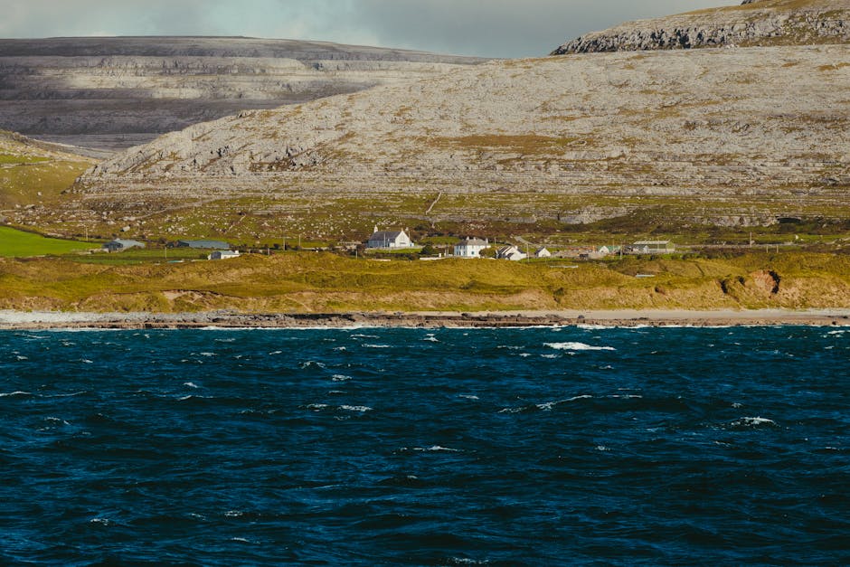 Wild Atlantic coastline with waves breaking against dark rocks
