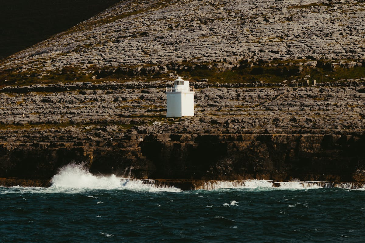 Lighthouse on Inishmore Island rocky coast County Galway Ireland