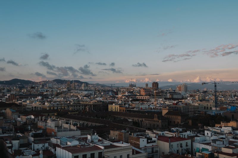 Barcelona city skyline at sunset with historic architecture visible