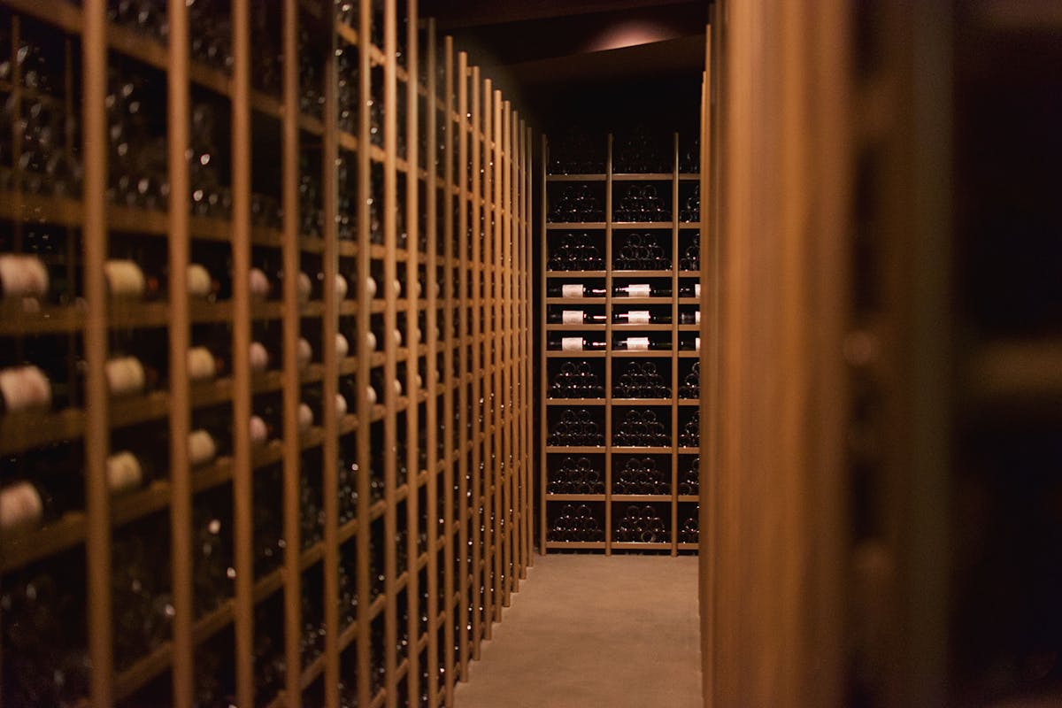 Elegant display of wine bottles arranged in rows in a cellar in Pauillac France