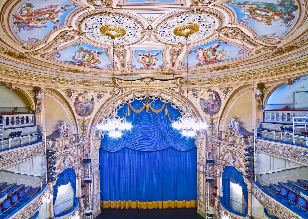 Elegant view of ornate grand theatre interior with detailed architecture