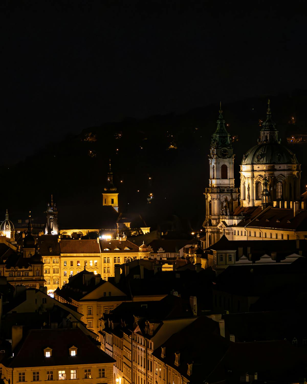 Illuminated gothic architecture in Prague captured at night