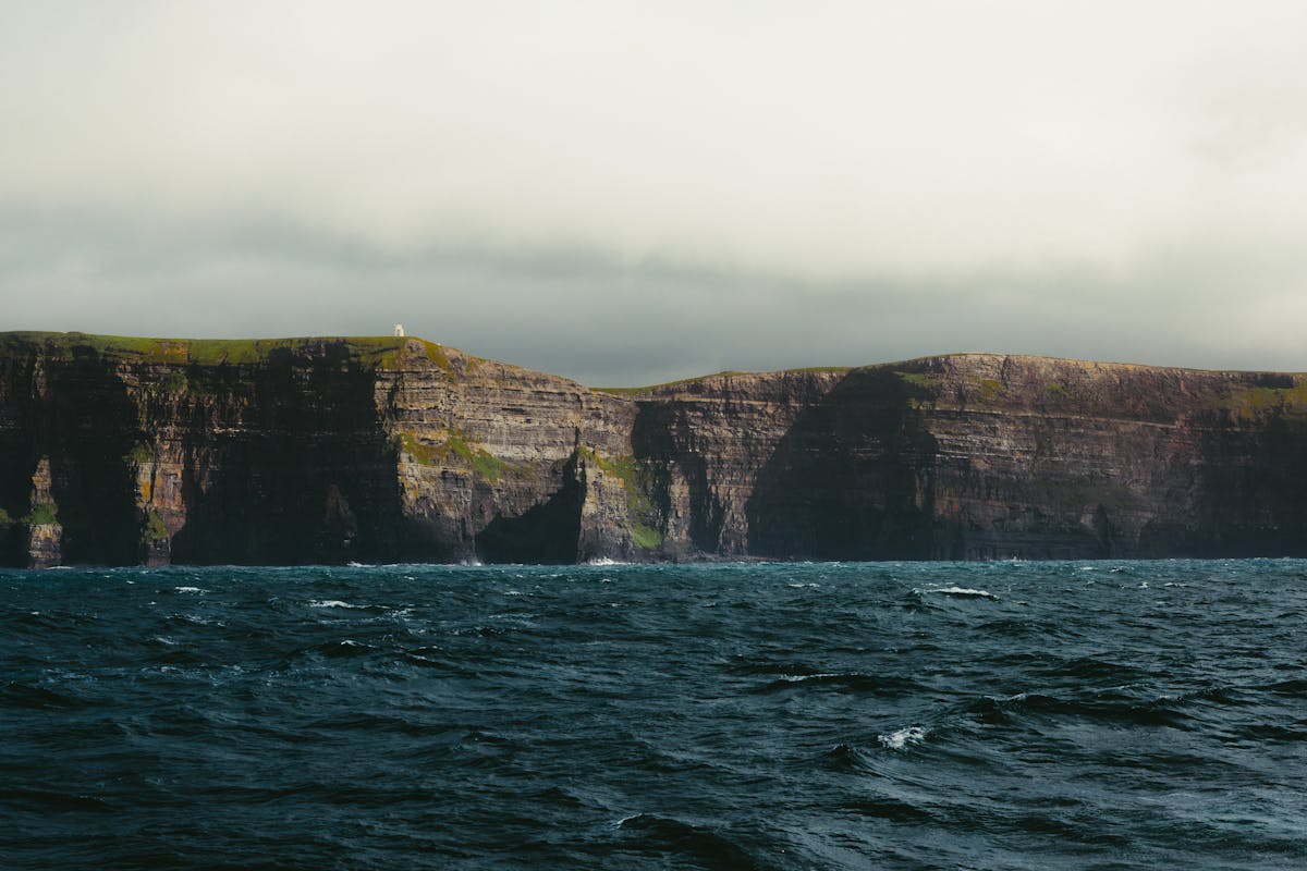 View of the Cliffs of Moher with deep blue Atlantic Ocean in the foreground