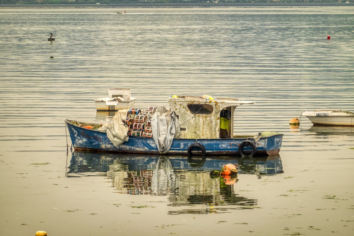 An old wooden fishing boat in the peaceful waters of Combarro Spain