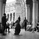 Traditional flamenco dancers performing in colorful dresses at Plaza de Espana in Seville Spain