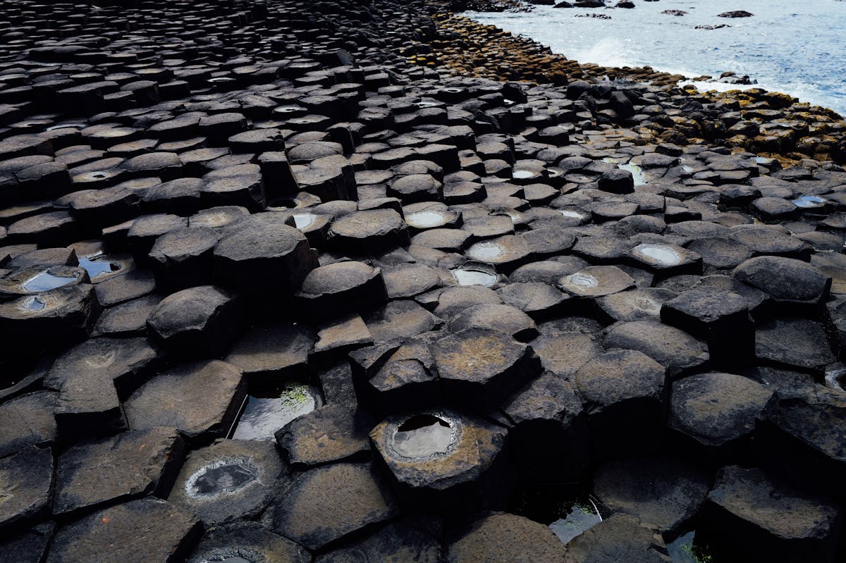 Interlocking basalt columns of the Giant Causeway by the rugged Northern Ireland coast