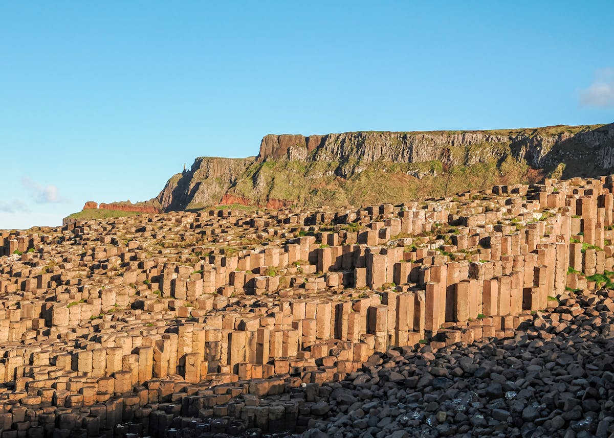 Stunning view of Giant Causeway hexagonal basalt columns with dramatic cliffs