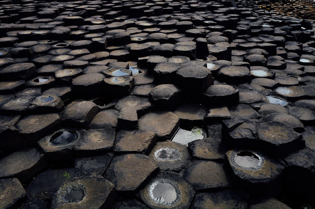 View of Giant Causeway basalt columns stretching along the coast